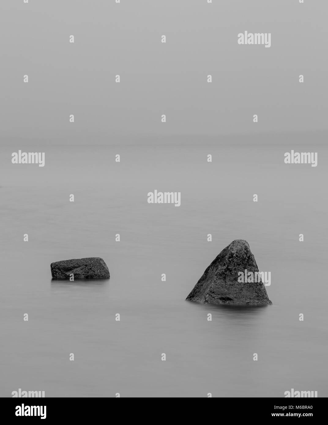 Stones in water Stock Photo - Alamy