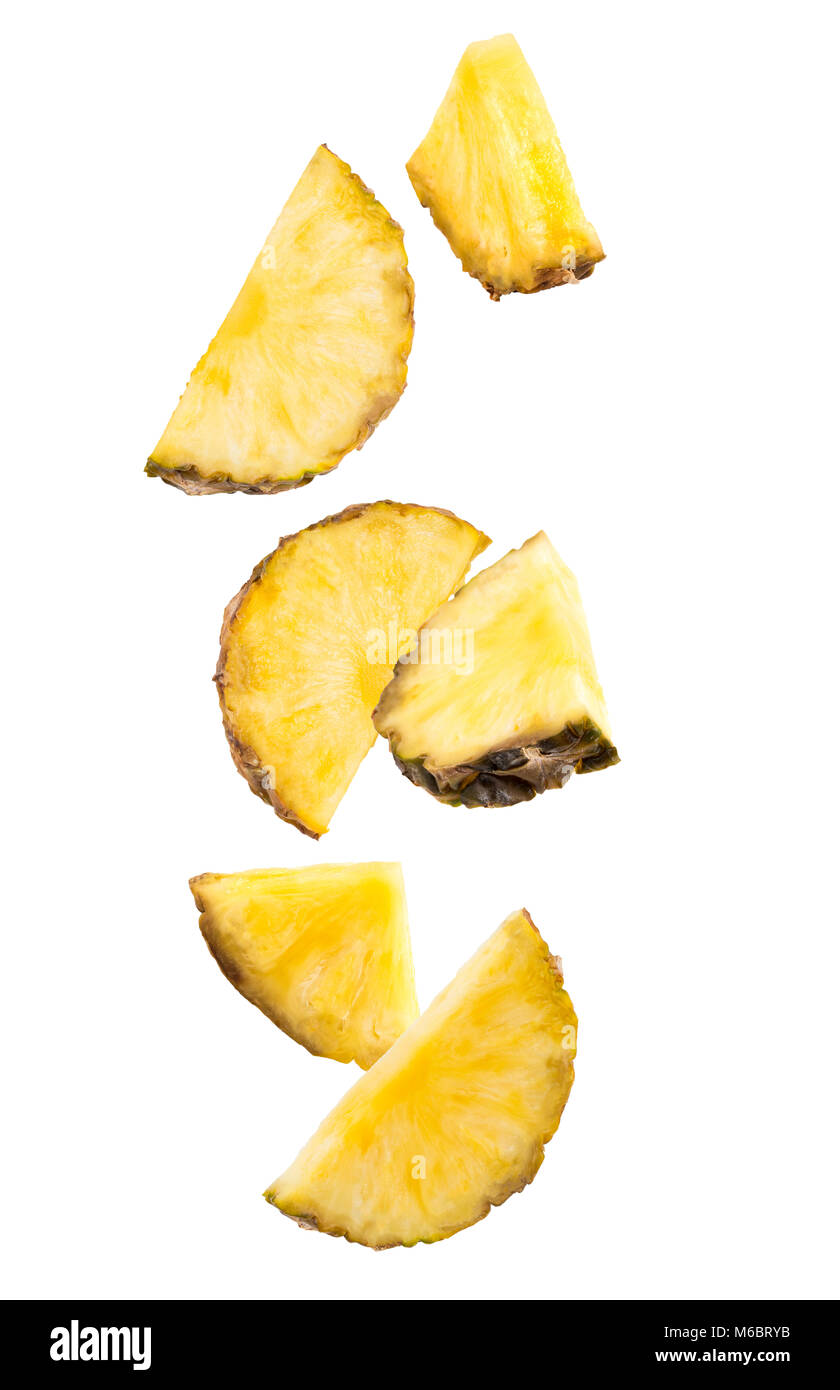 Falling slices of pineapple isolated on white Stock Photo - Alamy