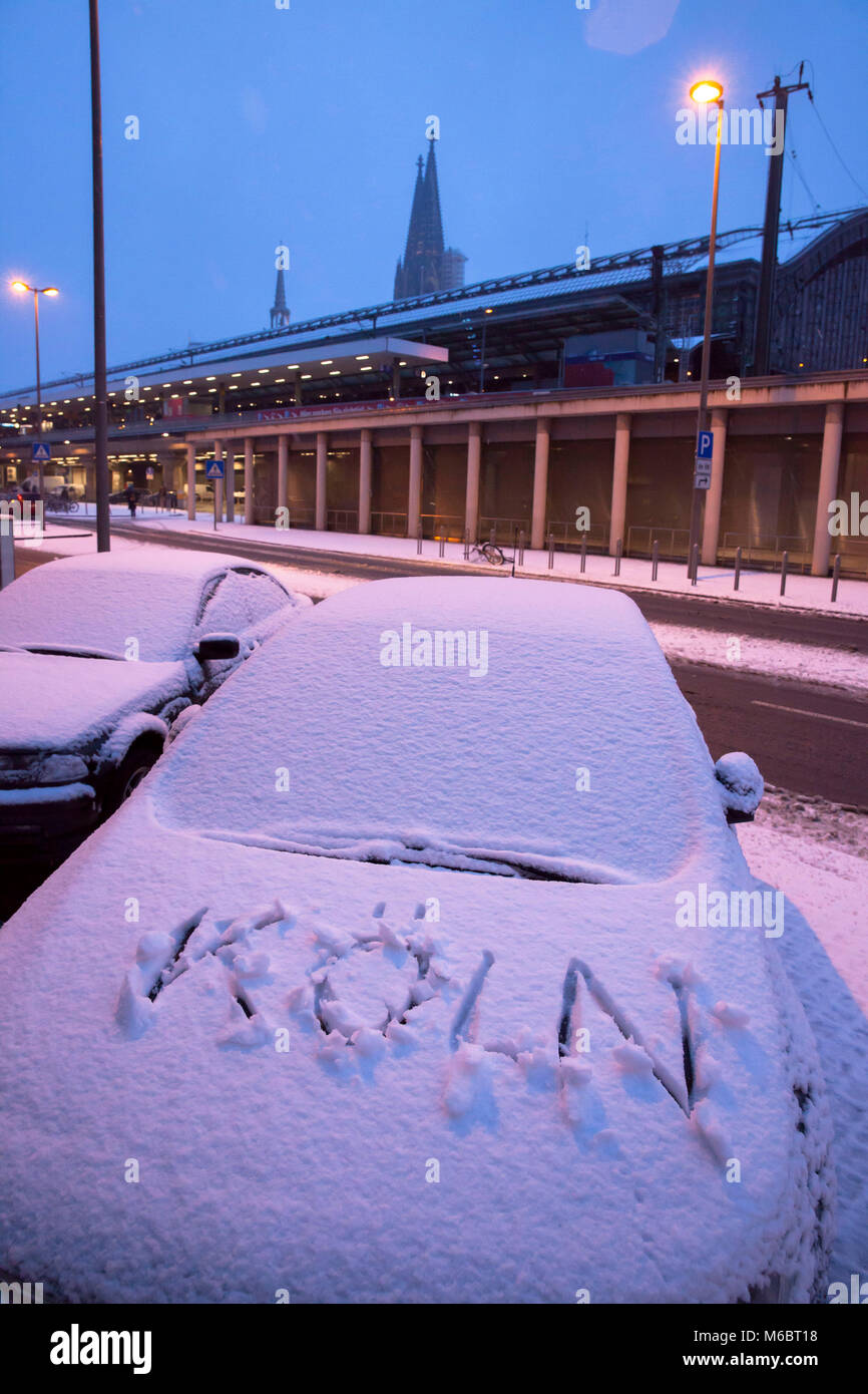 Germany, Cologne, snow-covered car with Koeln (Cologne) writing on the ...