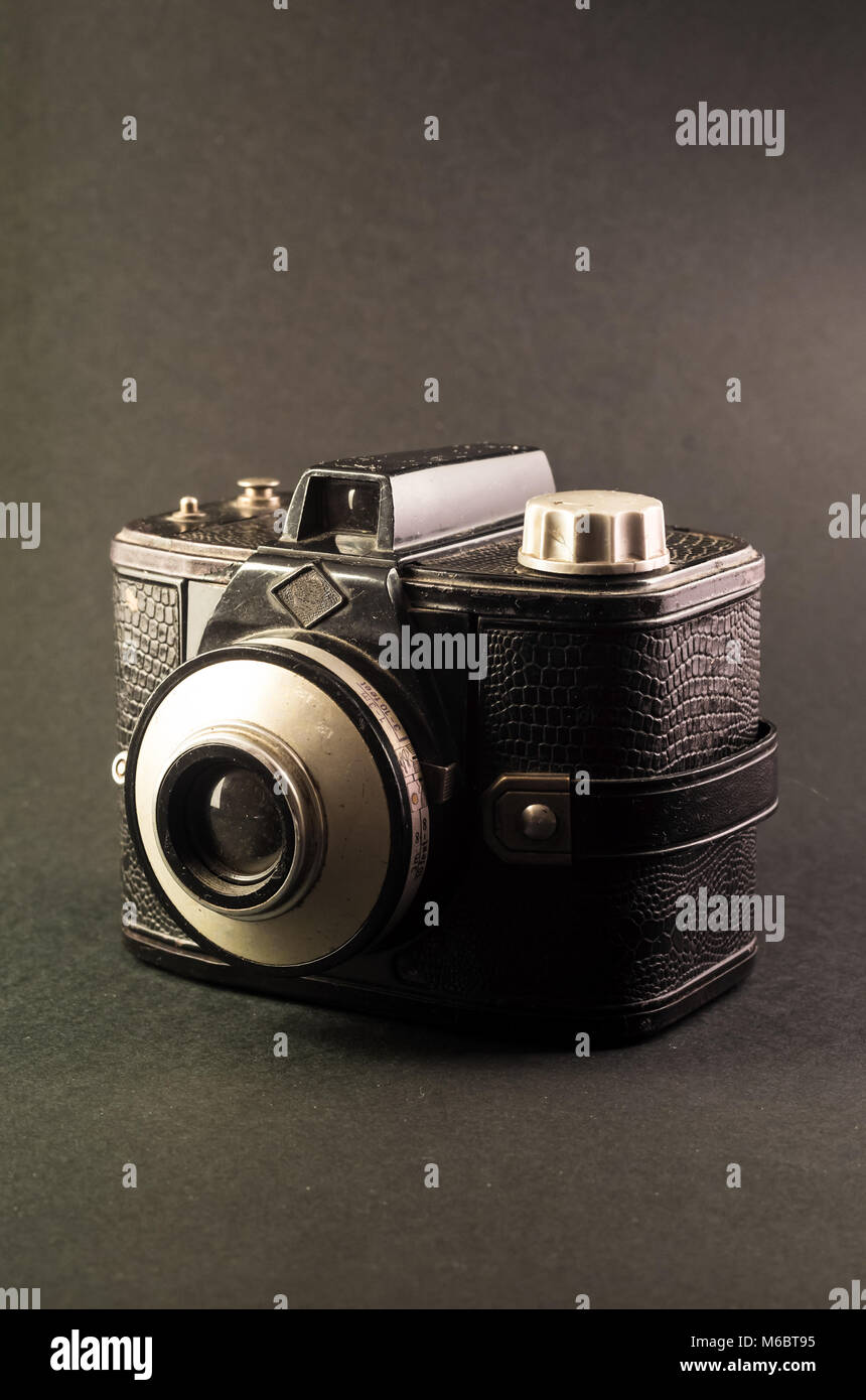 Old fashion film camera on grey background Stock Photo - Alamy