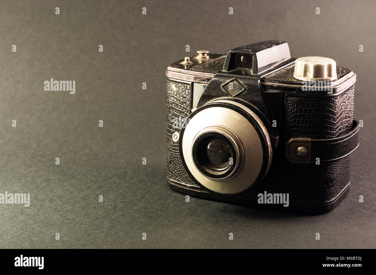 Retro film camera isolated on grey background Stock Photo - Alamy