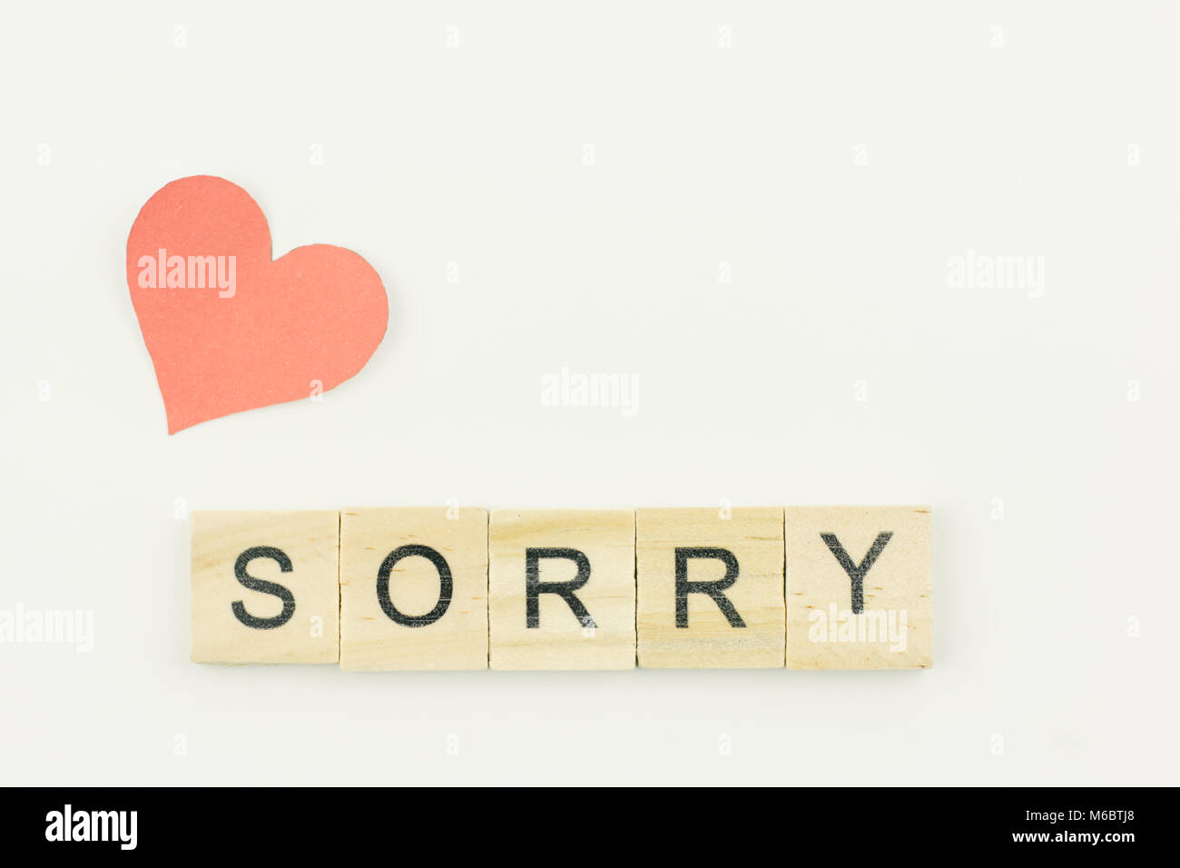 Text wooden blocks spelling the word sorry on white background Stock ...