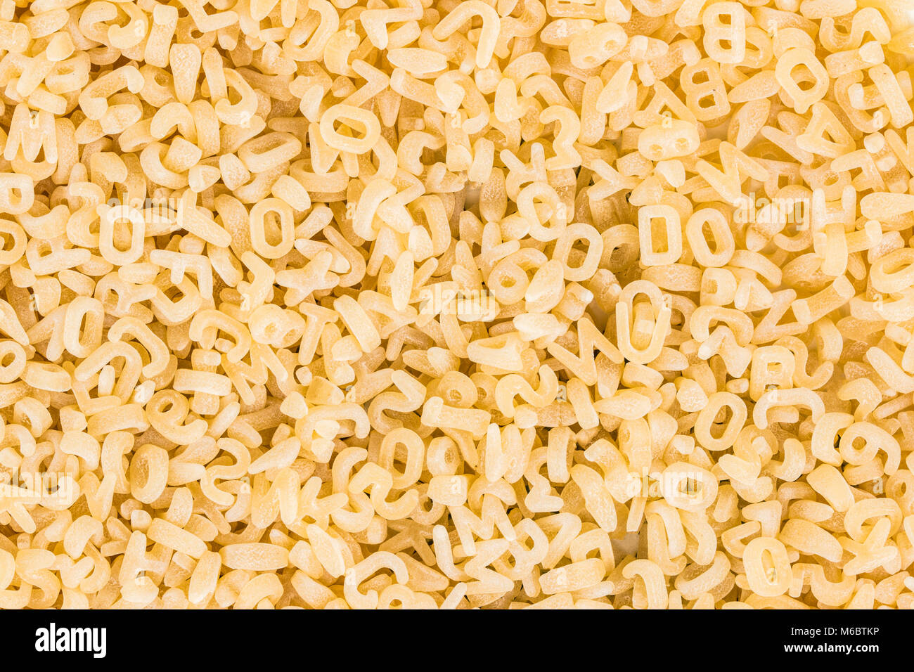 background of raw pasta in the form of letters and numbers Stock Photo ...