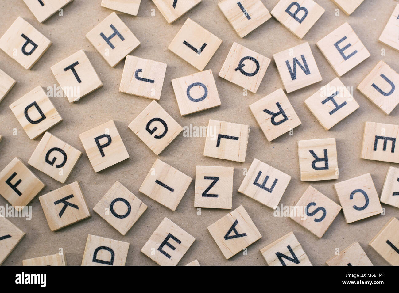 background of letterpress wood type printing blocks, random letters of ...