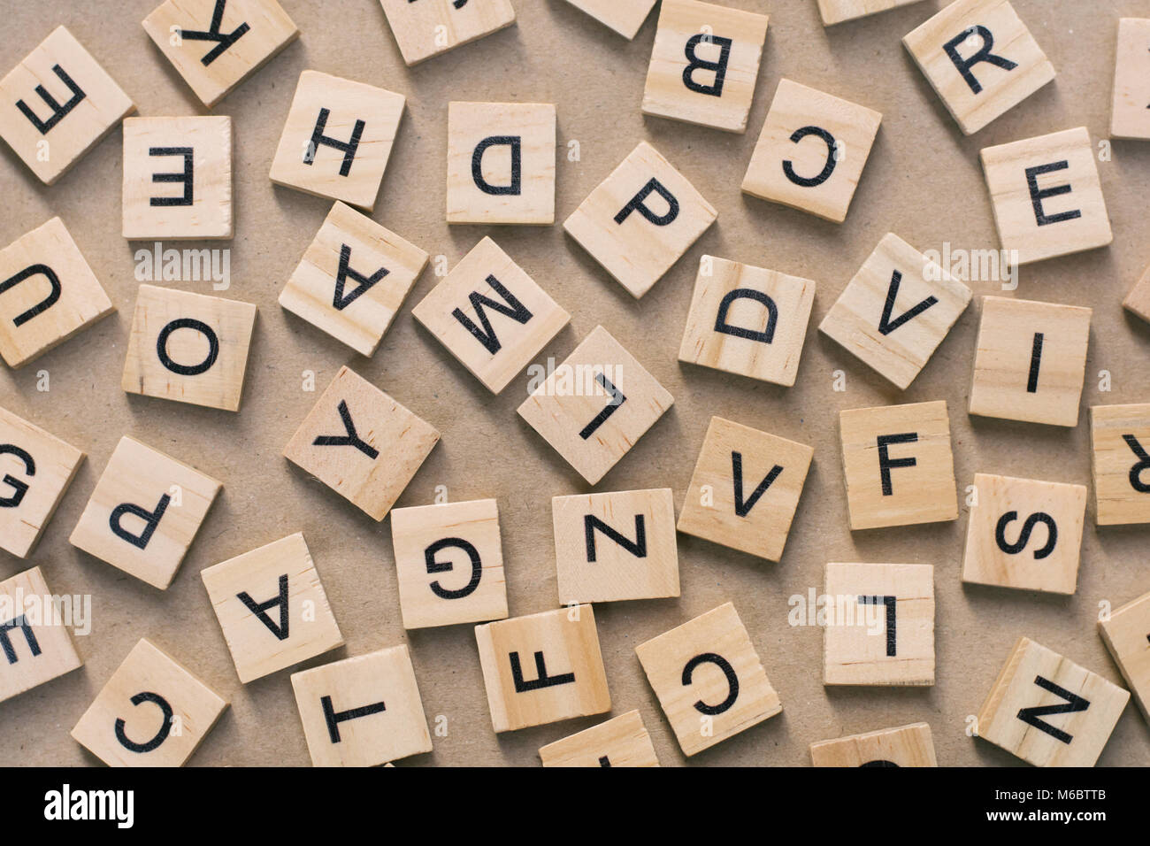 background of letterpress wood type printing blocks, random letters of ...