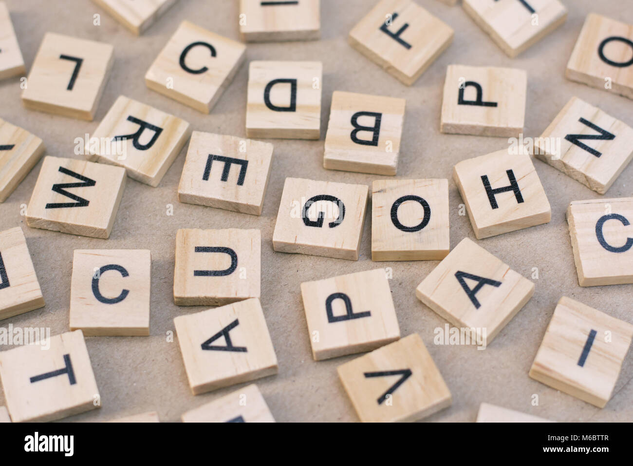 background of letterpress wood type printing blocks, random letters of ...