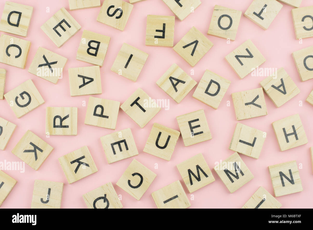 background of letterpress wood type printing blocks, random letters of ...