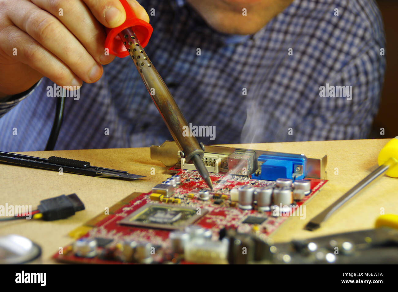 Man soldering hi-res stock photography and images - Alamy