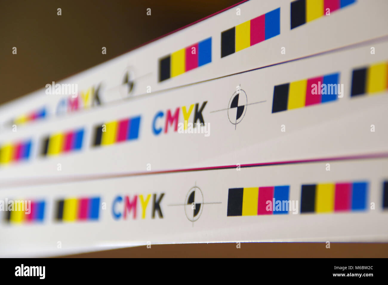 CMYK test printed on white paper. Cyan, magenta, yellow, black and ...