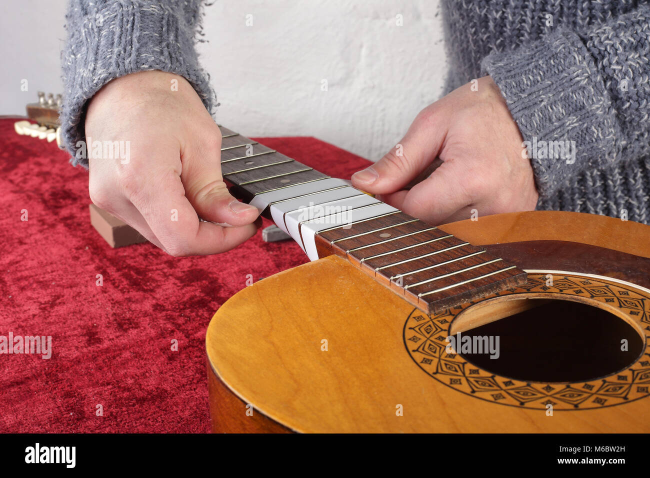Musical instrument guitar repair and service - Worker preparation ...