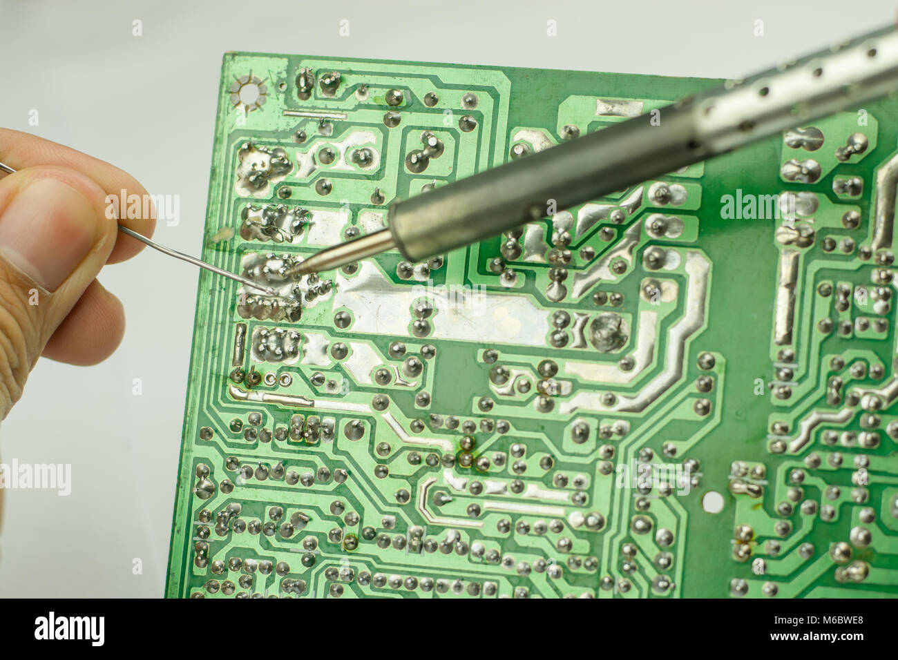 Repair of electronic devices, tin soldering parts Stock Photo - Alamy