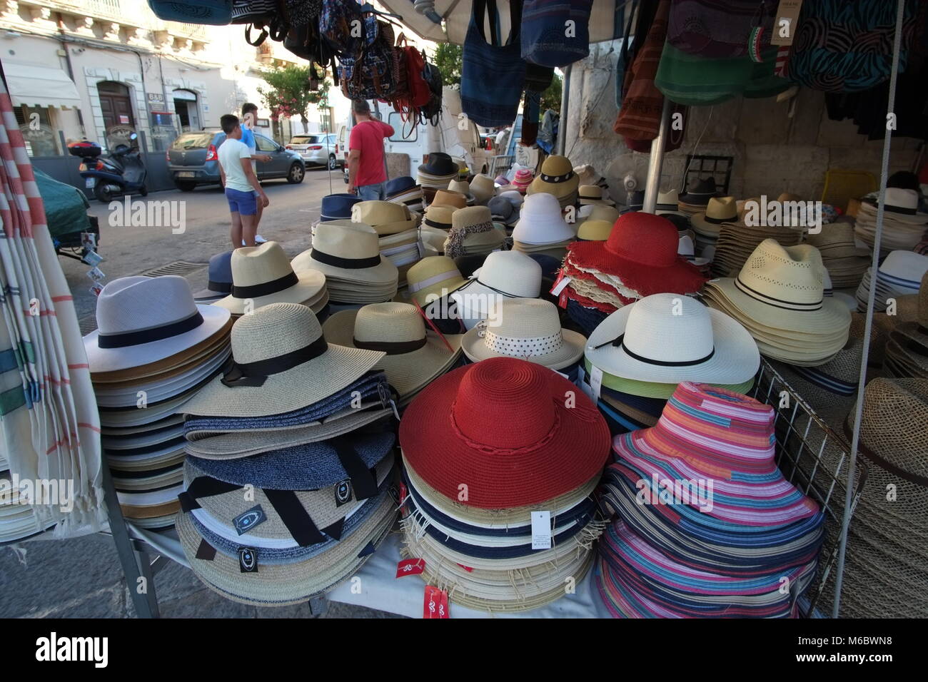 Market stall selling hats hi-res stock photography and images - Alamy