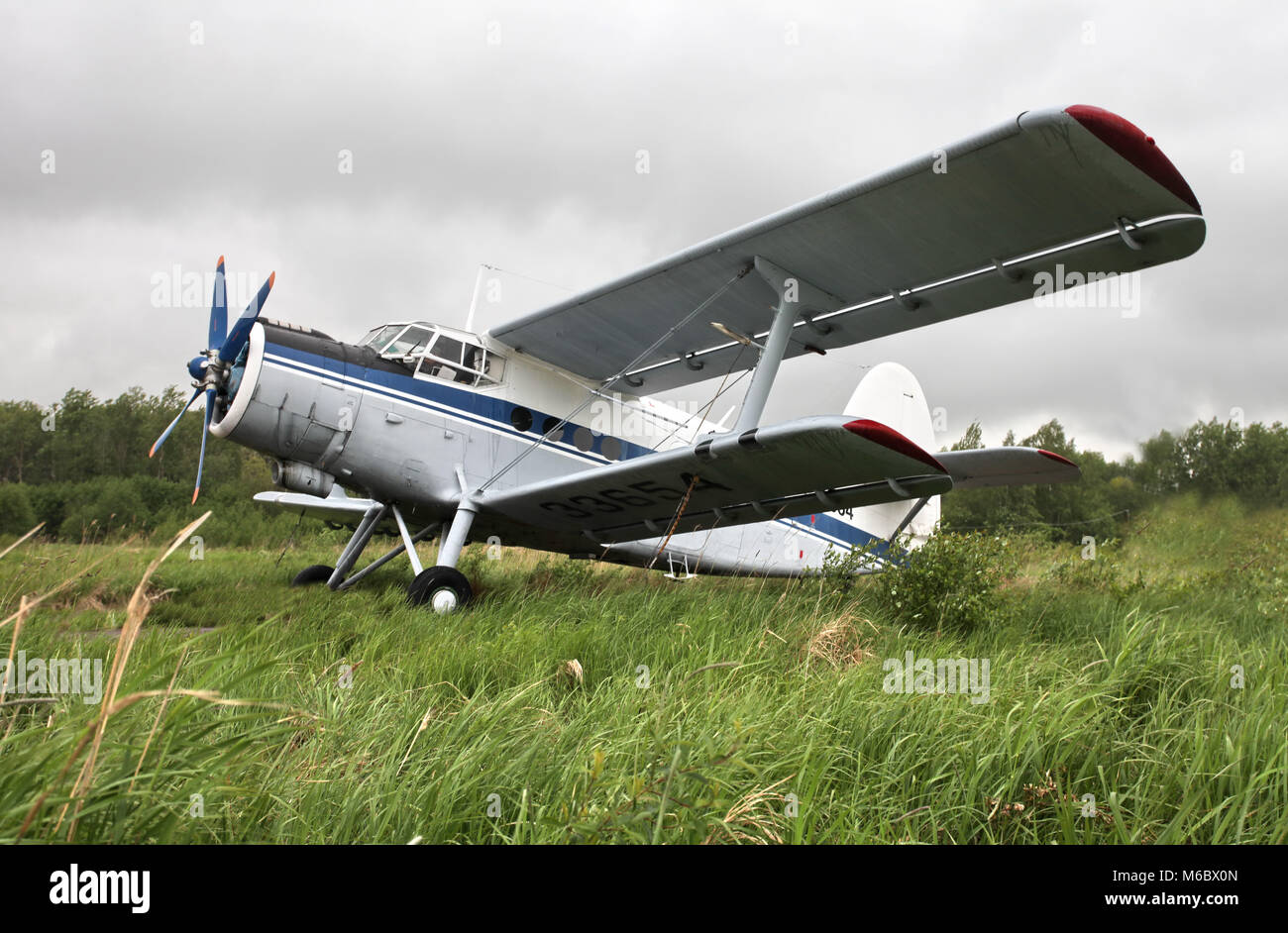 Biplane on the airfield side view Stock Photo - Alamy