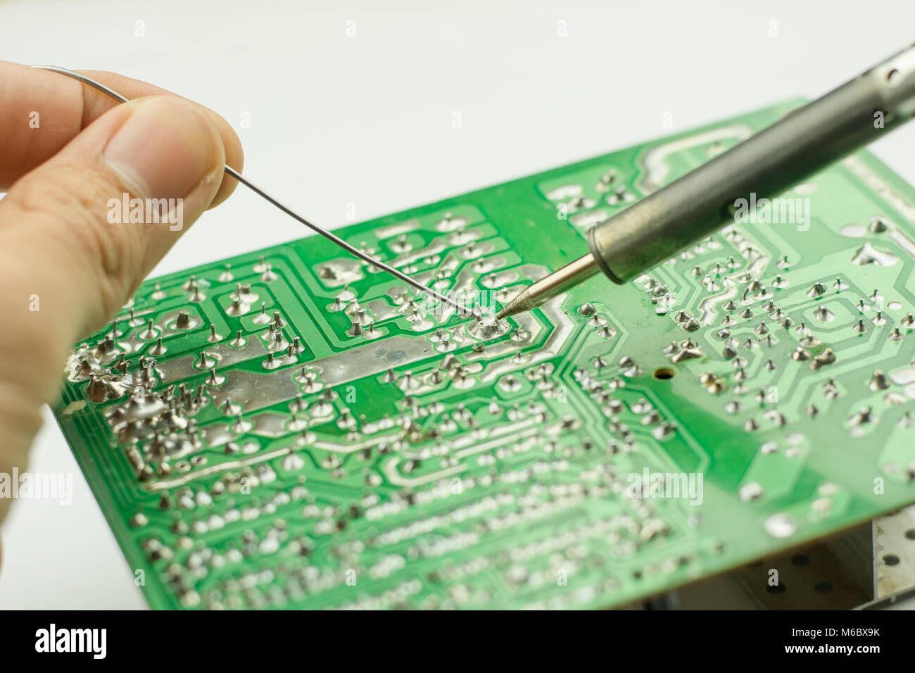 Repair of electronic devices, tin soldering parts Stock Photo - Alamy