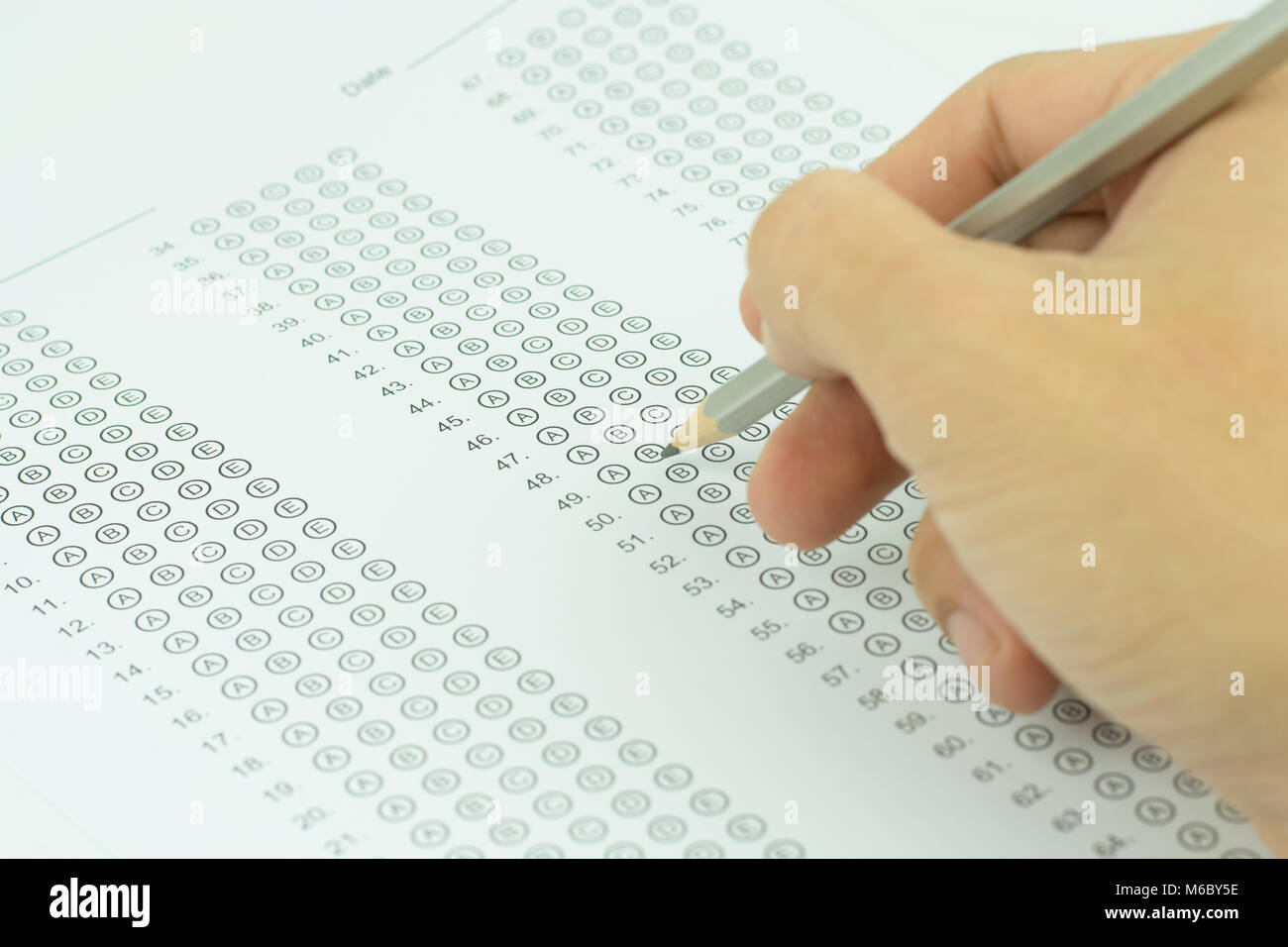 man hands filling in standardized test form Stock Photo - Alamy