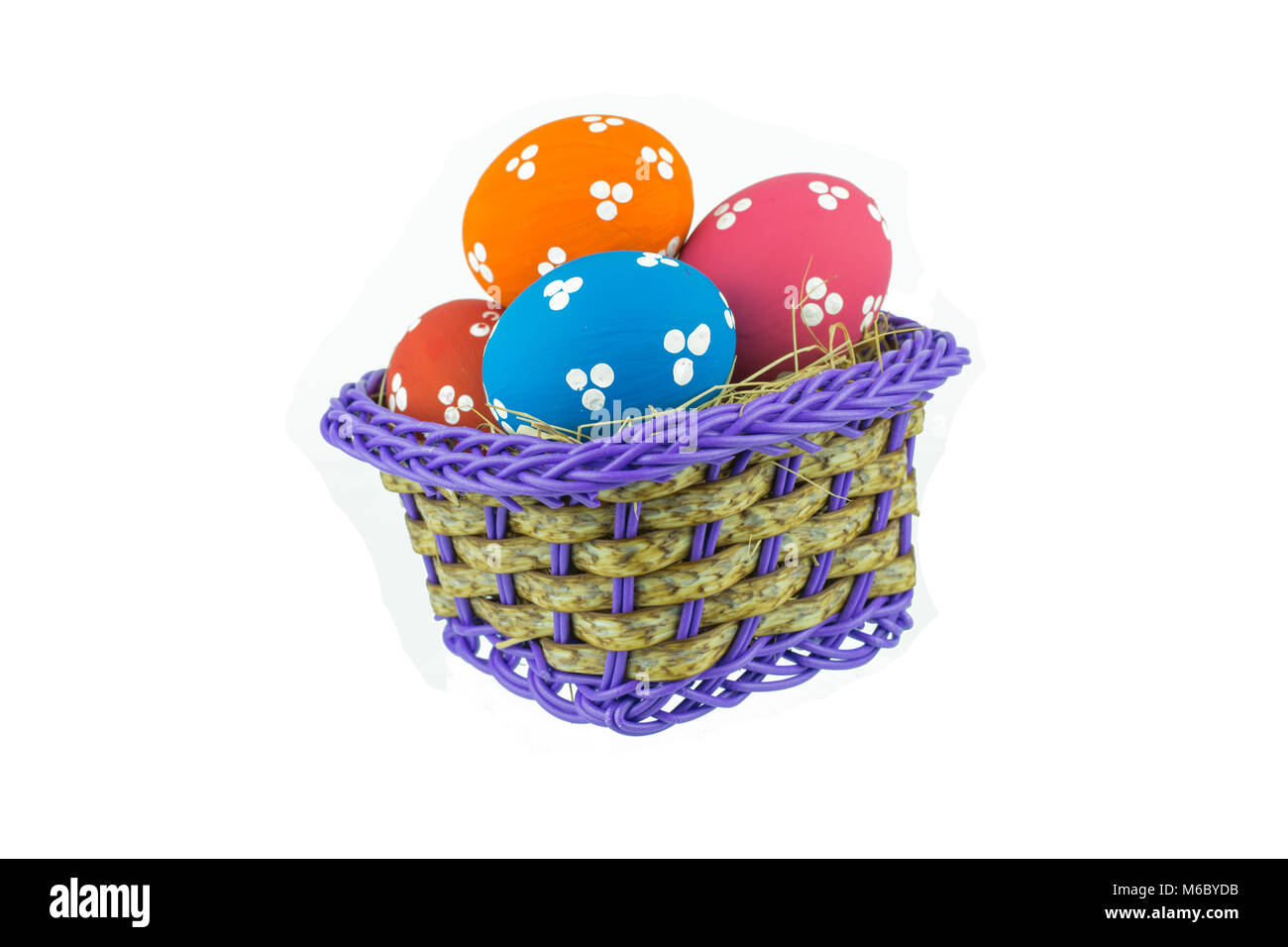 Easter eggs and basket isolated Stock Photo - Alamy