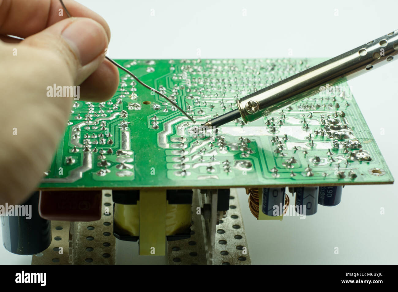 Repair of electronic devices, tin soldering parts Stock Photo - Alamy