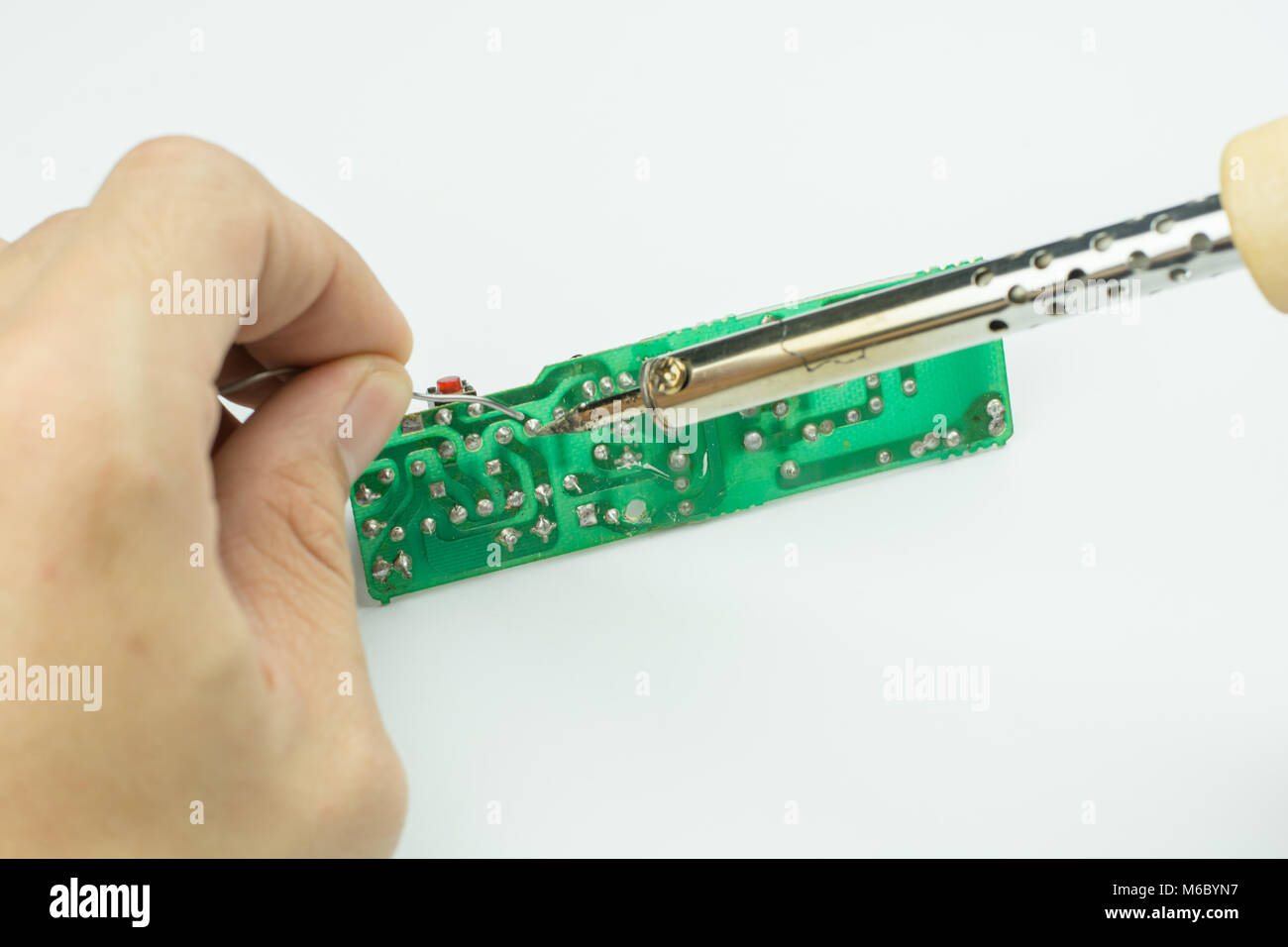 Repair of electronic devices, tin soldering parts Stock Photo - Alamy