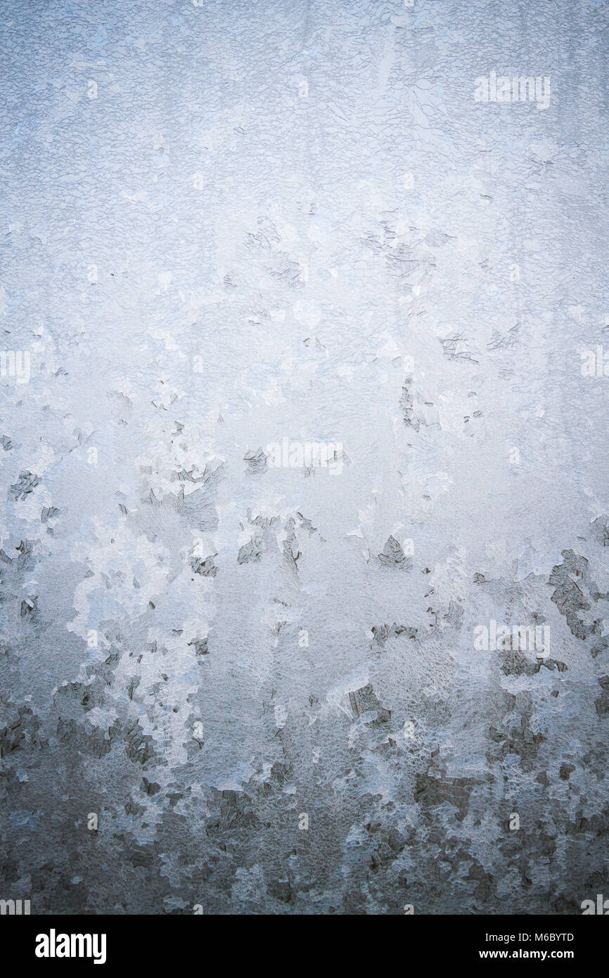 Winter frosty patterns on the frozen ice window Stock Photo - Alamy