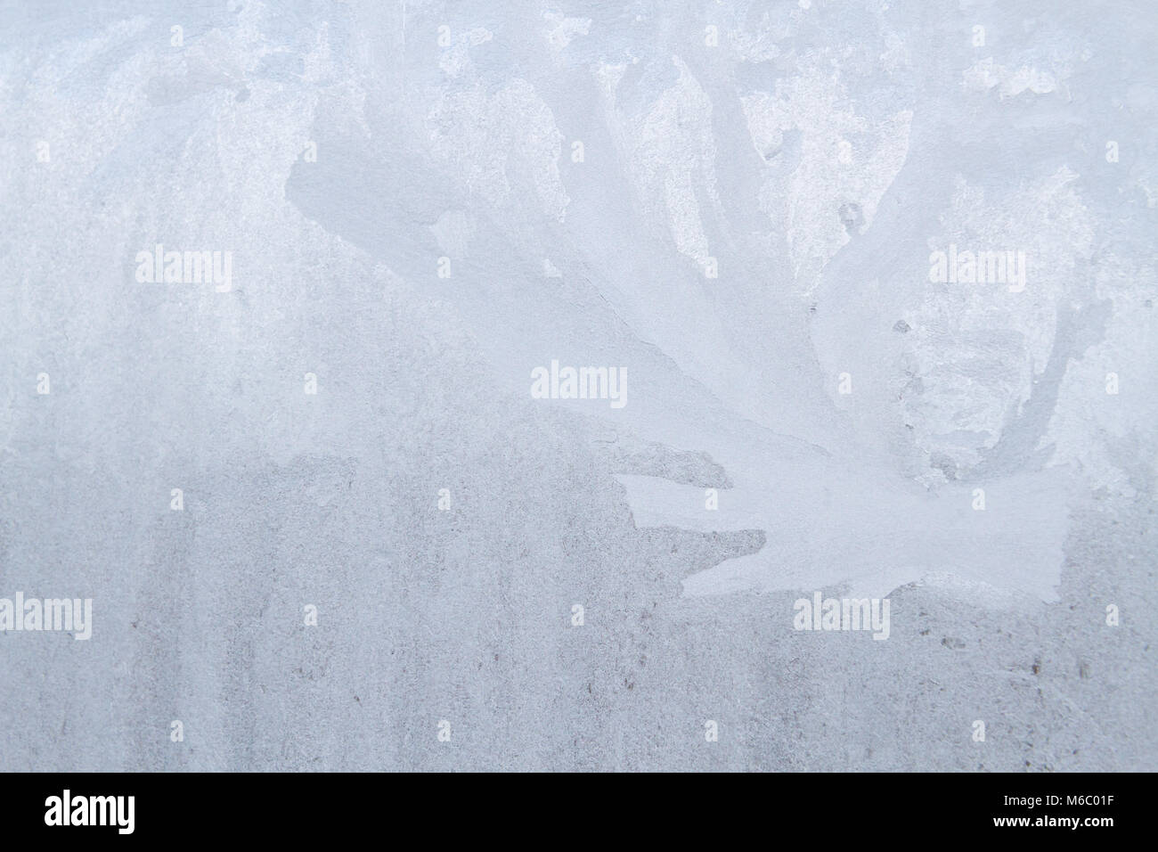 Winter frosty patterns on the frozen ice window Stock Photo - Alamy