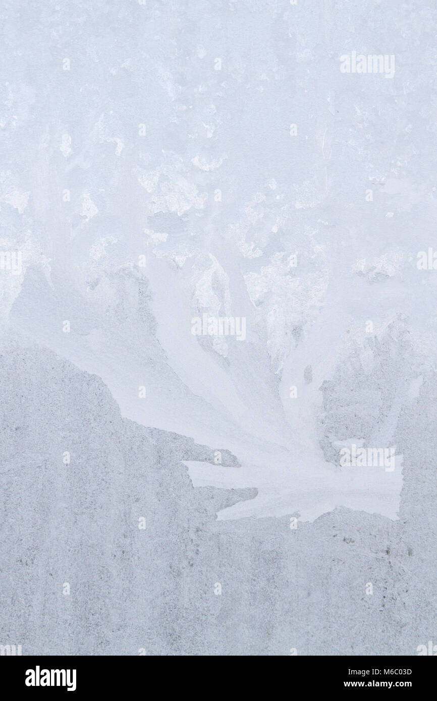 Winter frosty patterns on the frozen ice window Stock Photo - Alamy