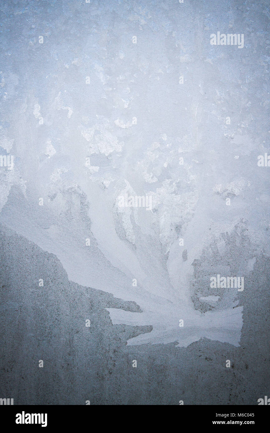 Winter frosty patterns on the frozen ice window Stock Photo - Alamy