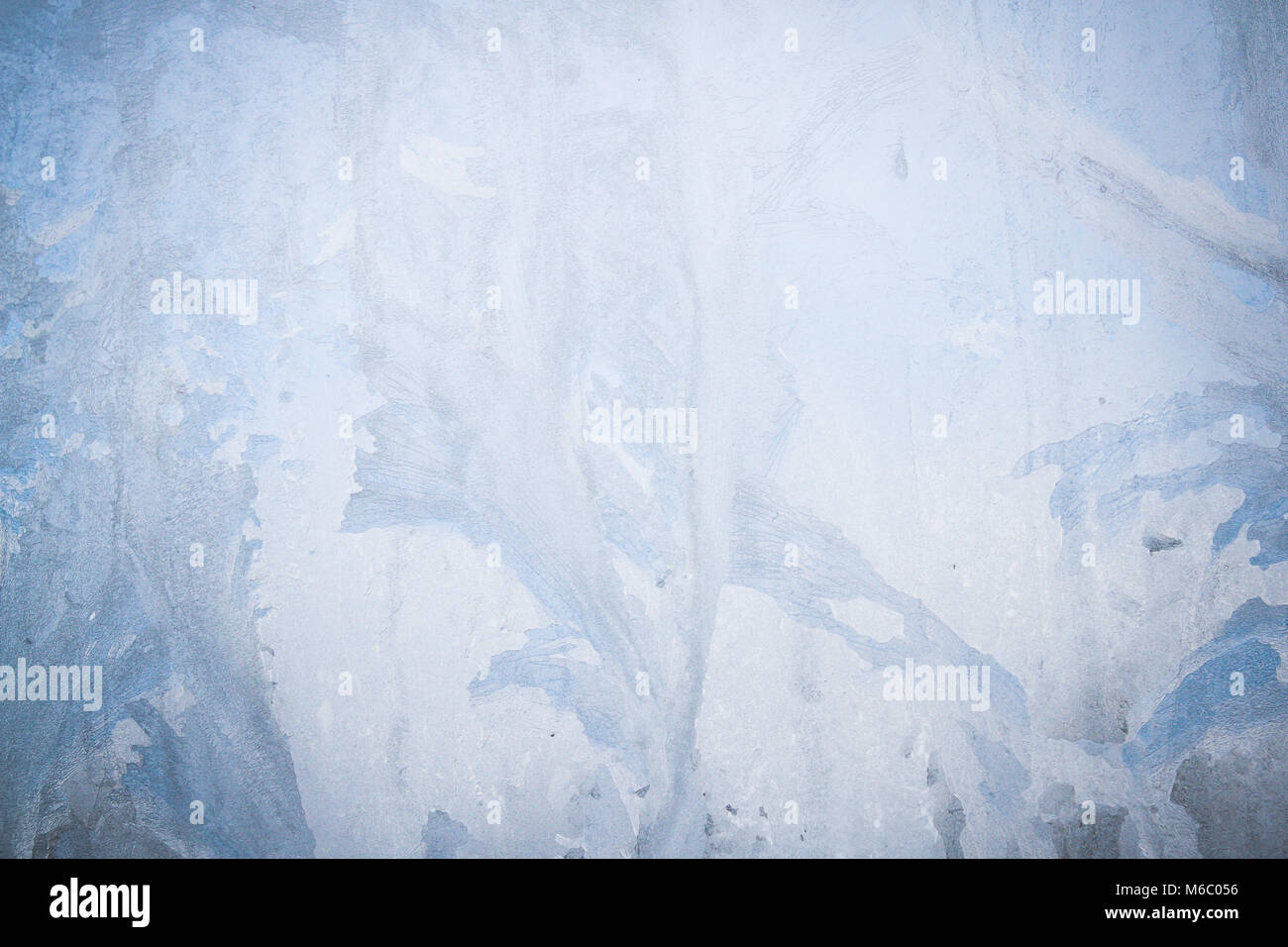 Winter frosty patterns on the frozen ice window Stock Photo - Alamy