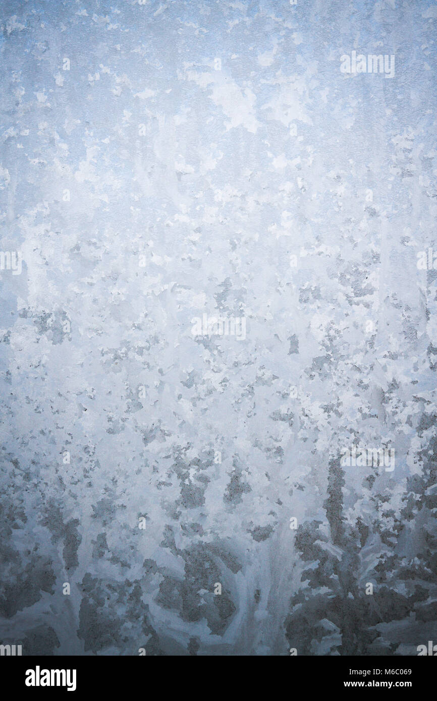 Winter frosty patterns on the frozen ice window Stock Photo - Alamy