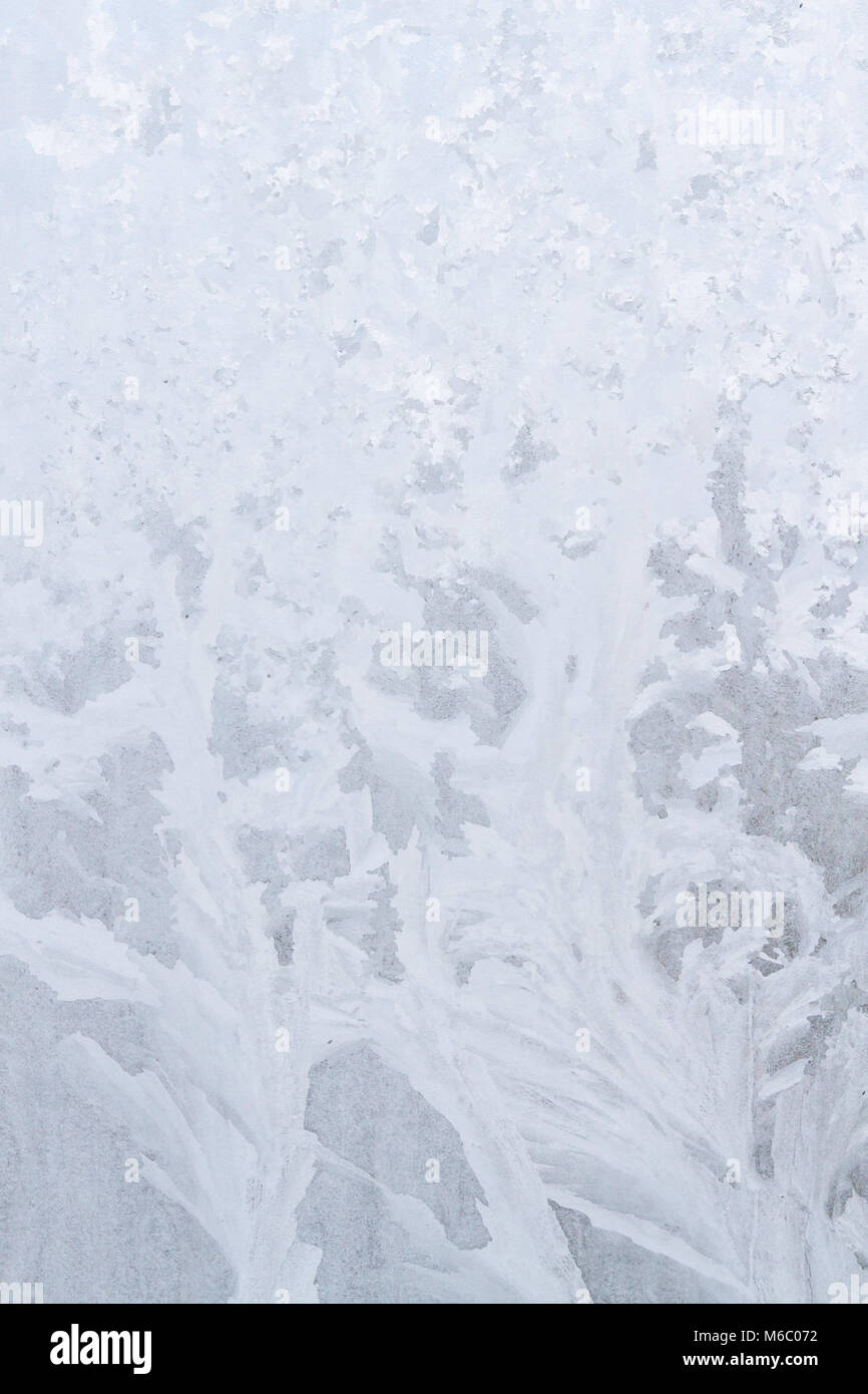 Winter frosty patterns on the frozen ice window Stock Photo - Alamy