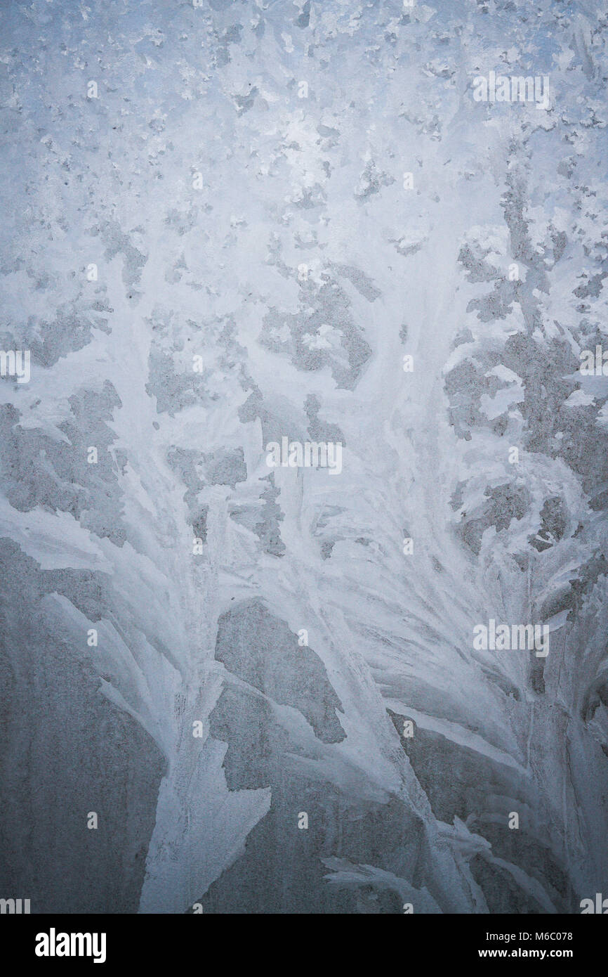 Winter frosty patterns on the frozen ice window Stock Photo - Alamy