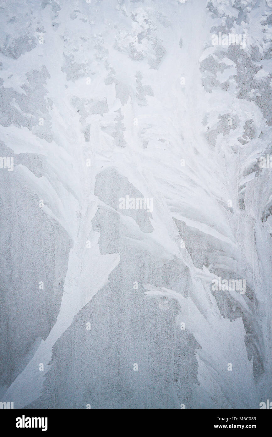 Winter frosty patterns on the frozen ice window Stock Photo - Alamy