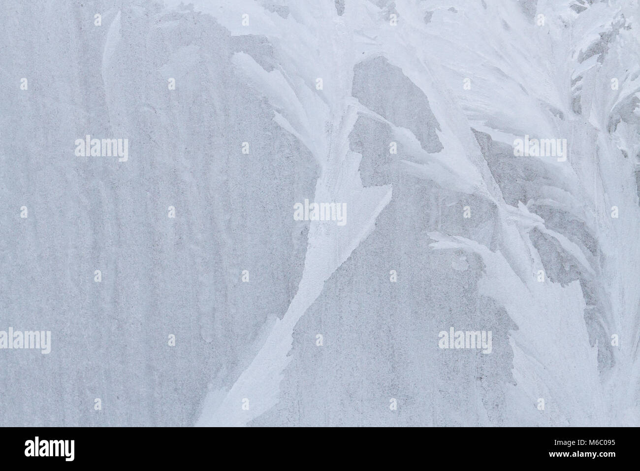 Winter frosty patterns on the frozen ice window Stock Photo - Alamy