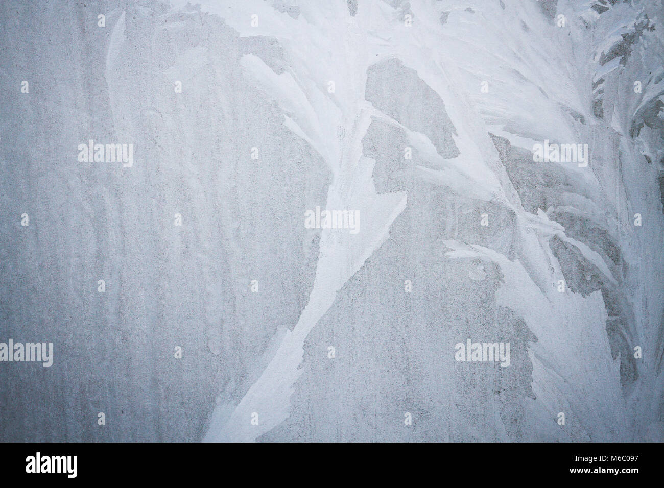 Winter frosty patterns on the frozen ice window Stock Photo - Alamy