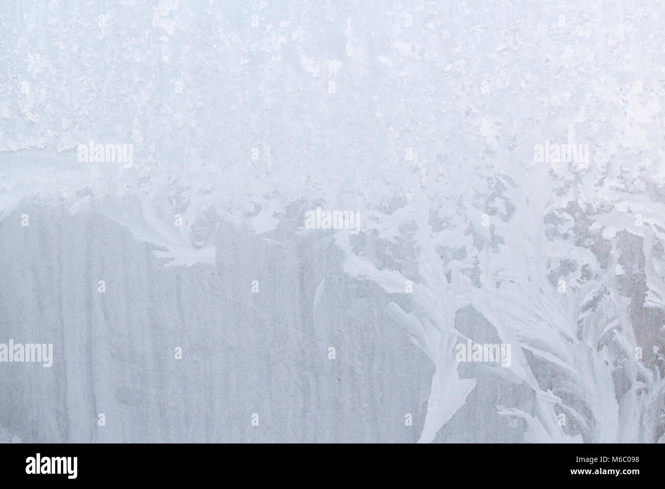 Winter frosty patterns on the frozen ice window Stock Photo - Alamy