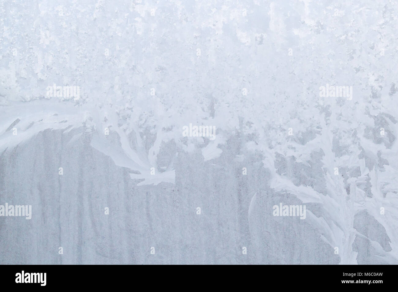 Winter frosty patterns on the frozen ice window Stock Photo - Alamy
