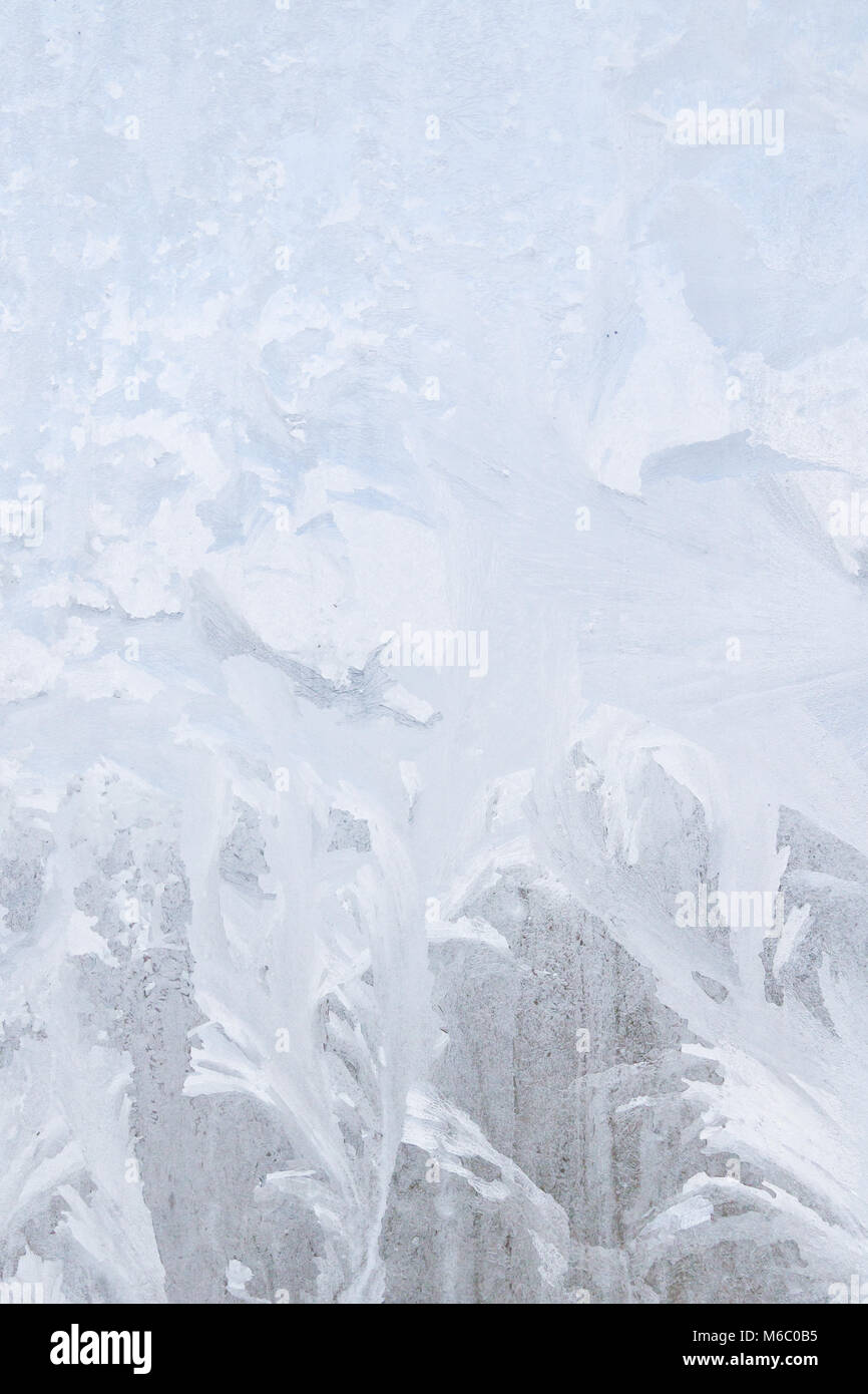 Winter frosty patterns on the frozen ice window Stock Photo - Alamy