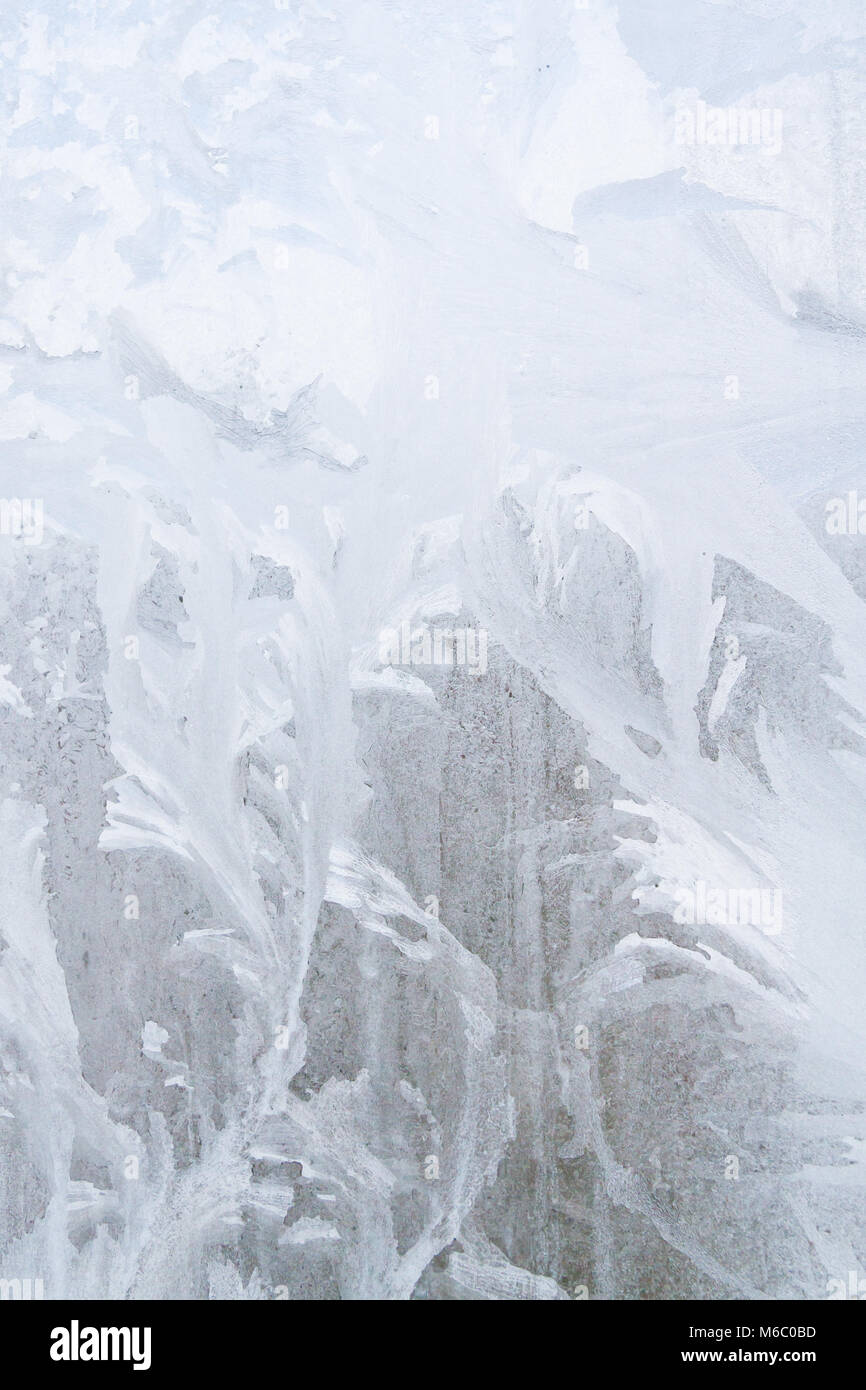 Winter frosty patterns on the frozen ice window Stock Photo - Alamy