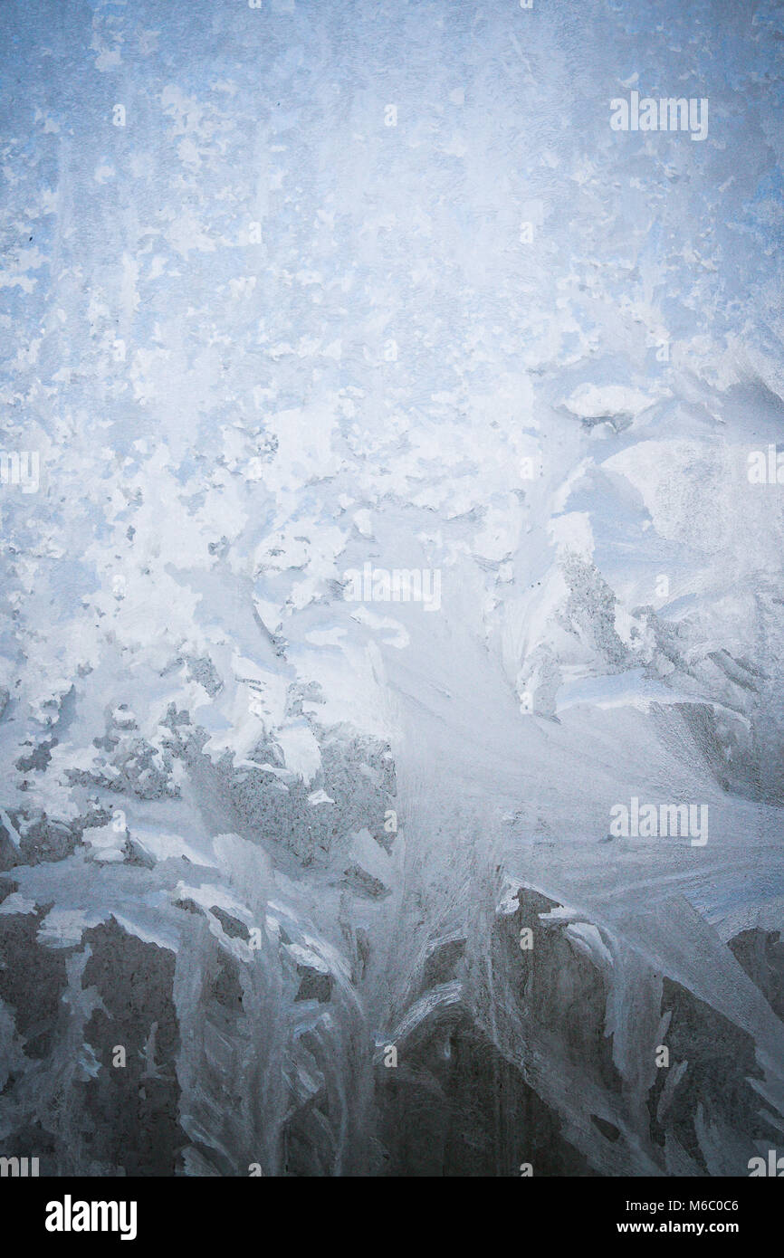 Winter frosty patterns on the frozen ice window Stock Photo - Alamy