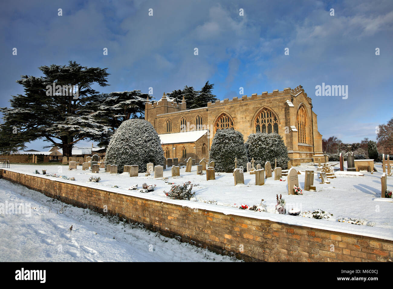 Winter snow covering St Marys church, Marholm village, Cambridgeshire ...