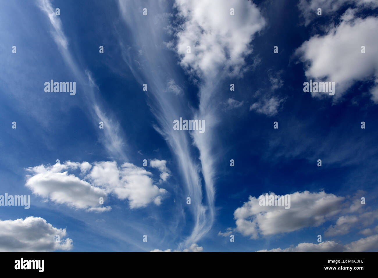 Cirrus clouds and Cumulus humilis clouds in a deep blue sky Stock Photo ...