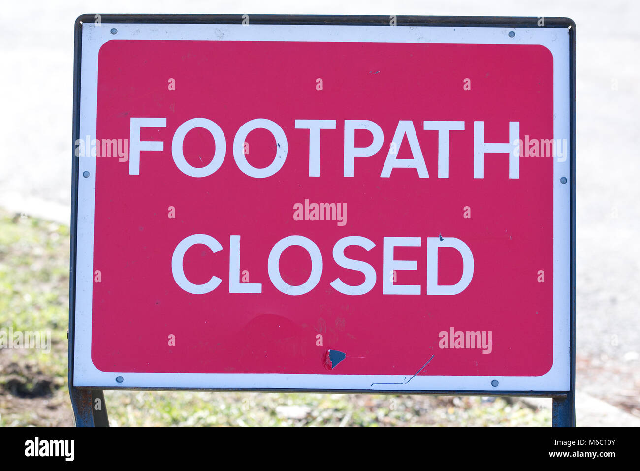 scratched footpath closed sign white sign on a red background Stock ...