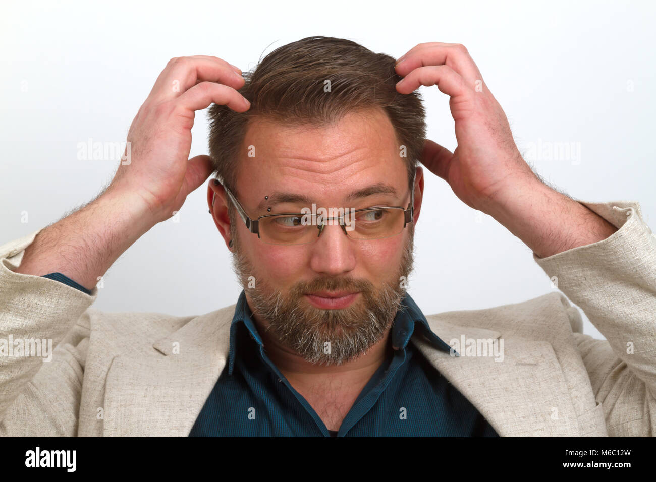 Stressed Man with his hands in his Face on bright background Stock ...