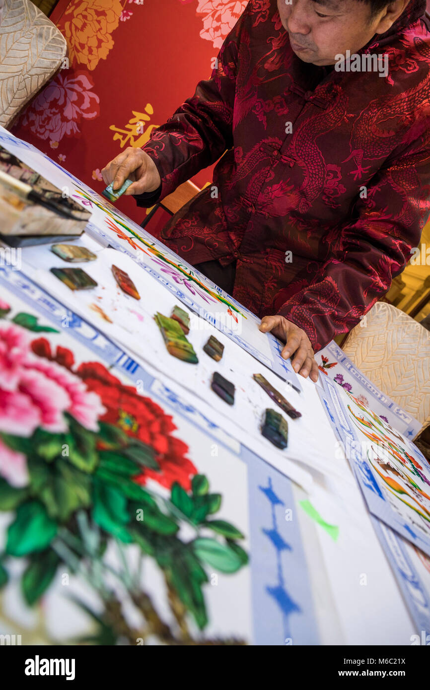 The Chinese master Tian is engaged in the art of calligraphy Stock ...