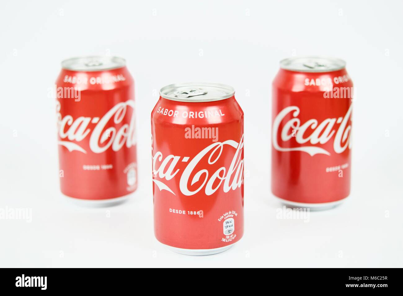 Cans of coca-cola on white background Stock Photo - Alamy