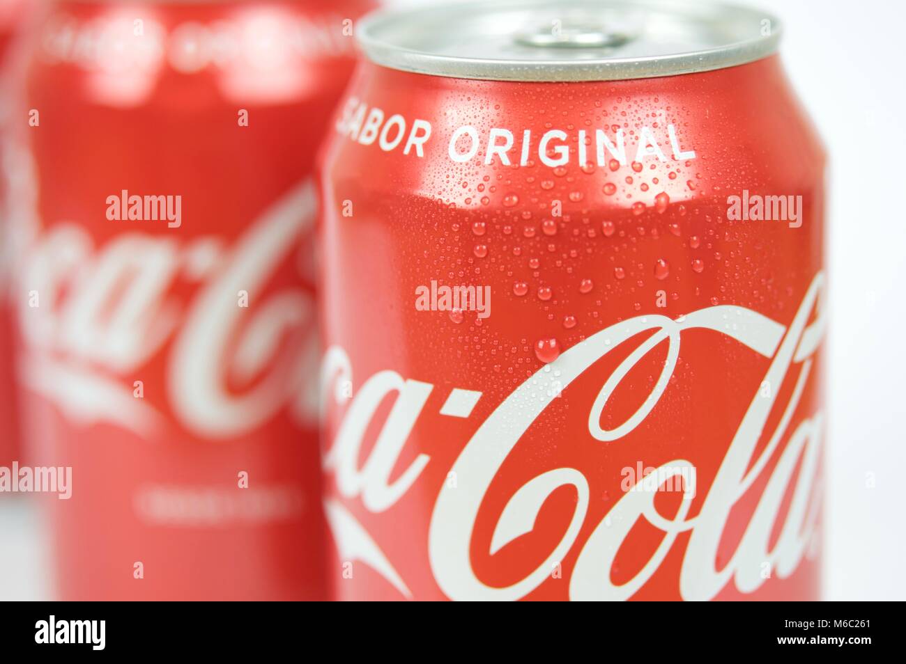 Cans of coca-cola on white background Stock Photo - Alamy