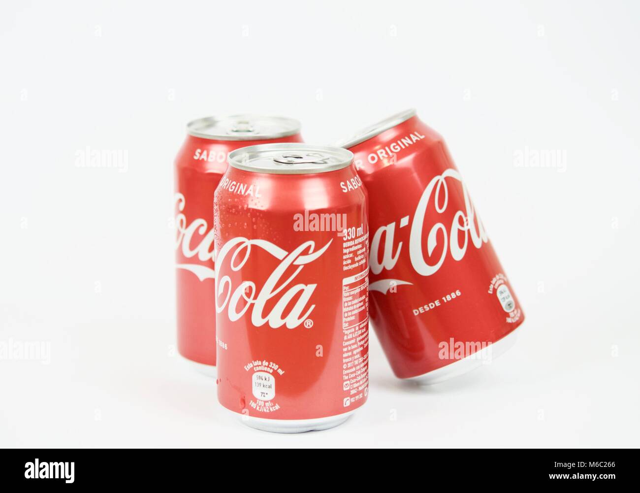 Cans of coca-cola on white background Stock Photo - Alamy