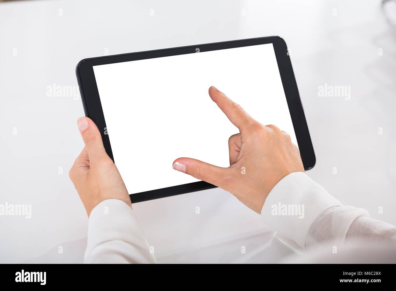 Human Hand Holding Digital Tablet With Blank White Screen Stock Photo ...