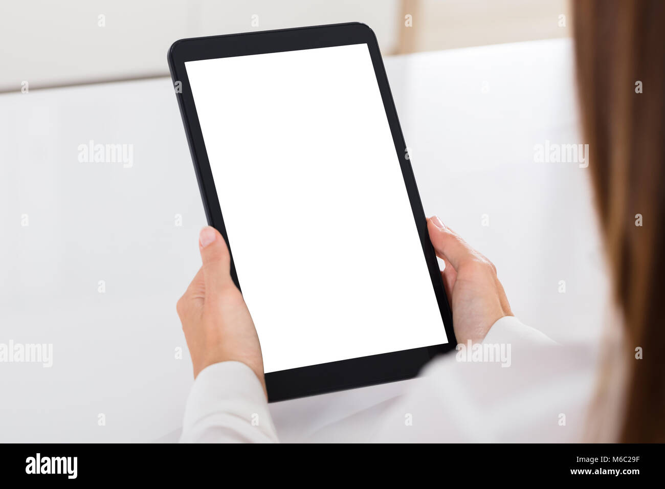 Human Hand Holding Digital Tablet With Blank White Screen Stock Photo ...