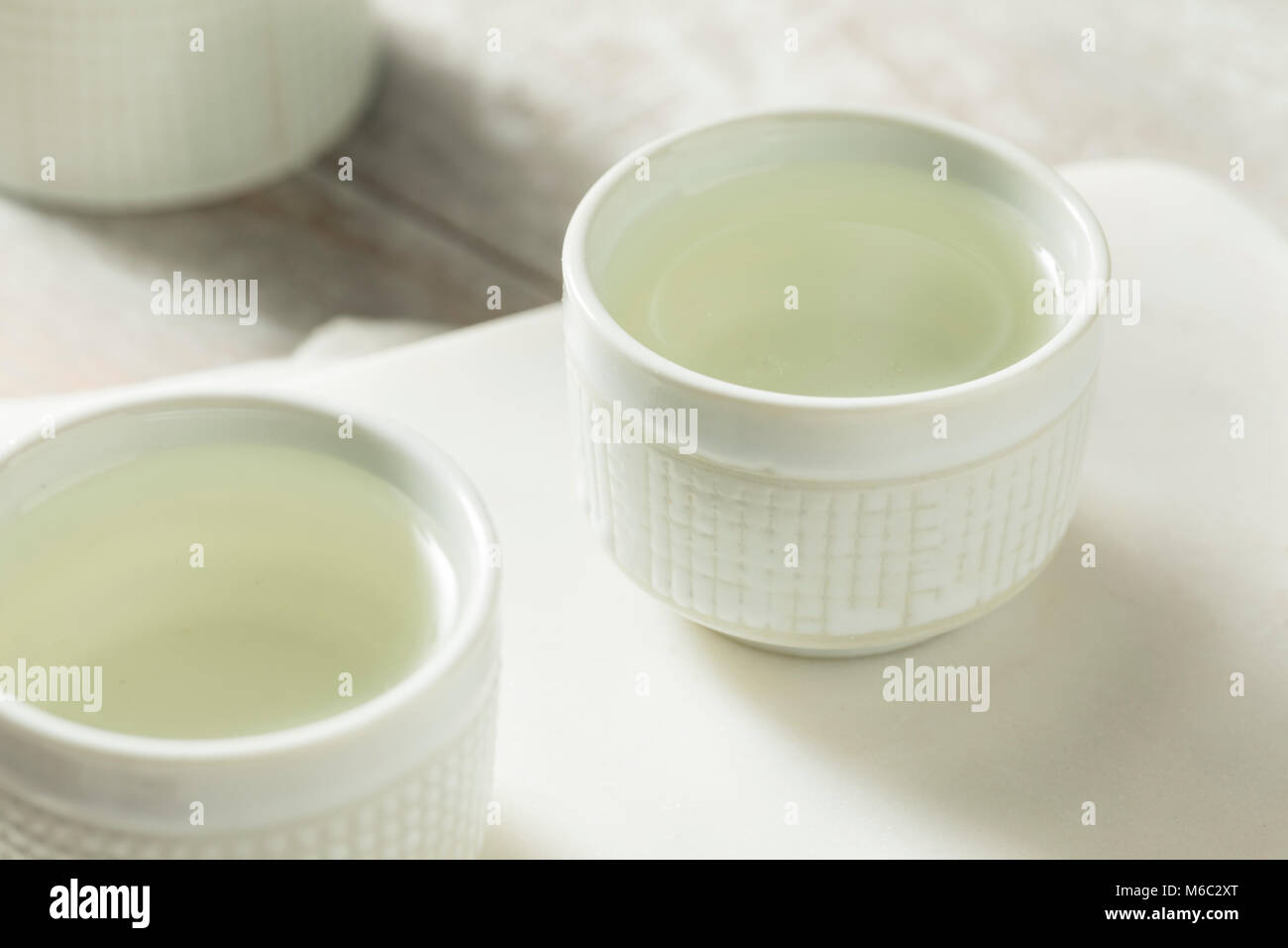 Alcoholic Japanese Sake Rice Wine in a Ceramic Glass Stock Photo - Alamy