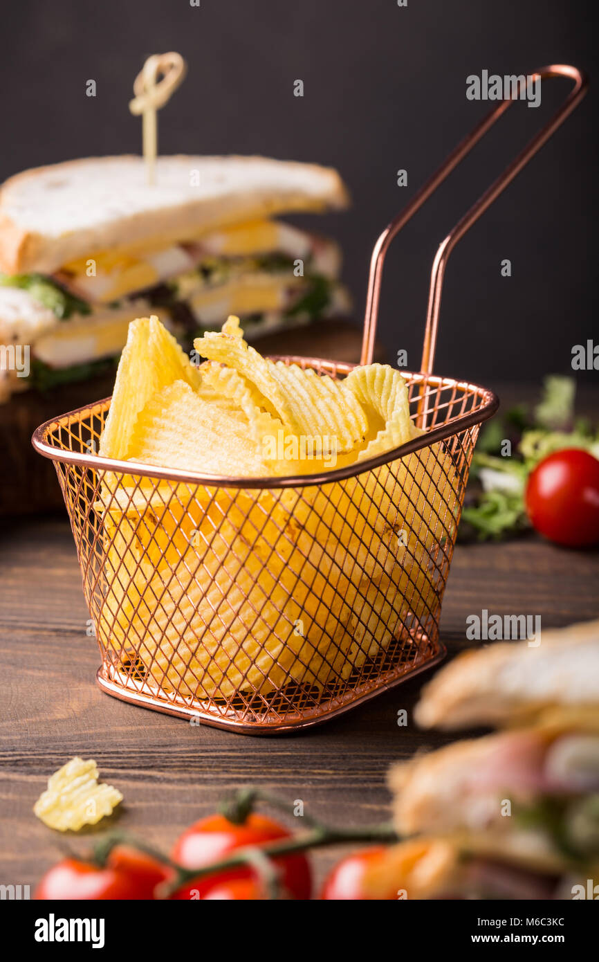 Crispy potato chips in copper basket Stock Photo - Alamy